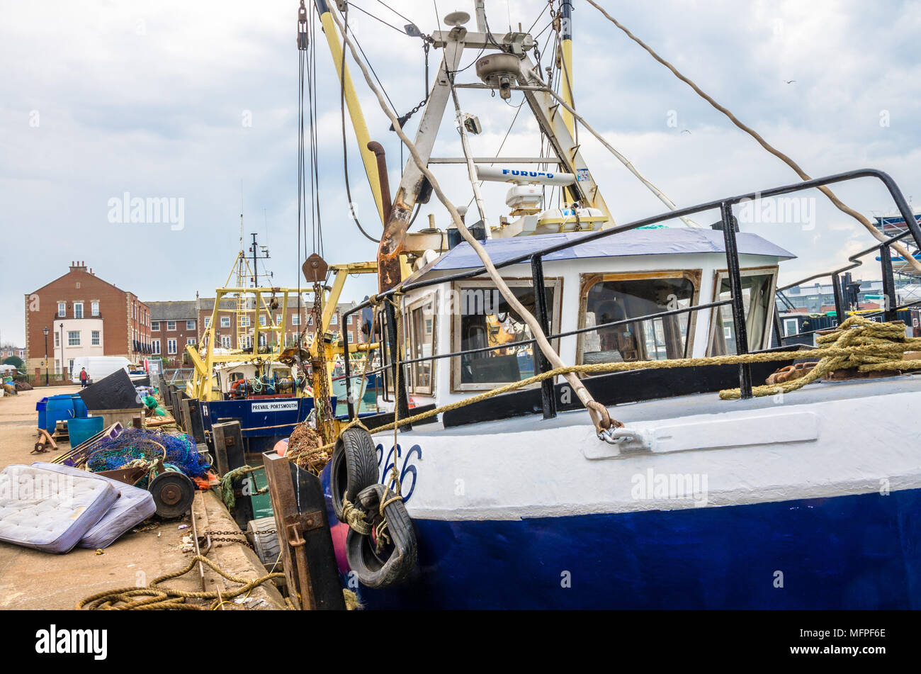 Fishing boats moored on the quayside in portsmouth harbour Stock Photo ...