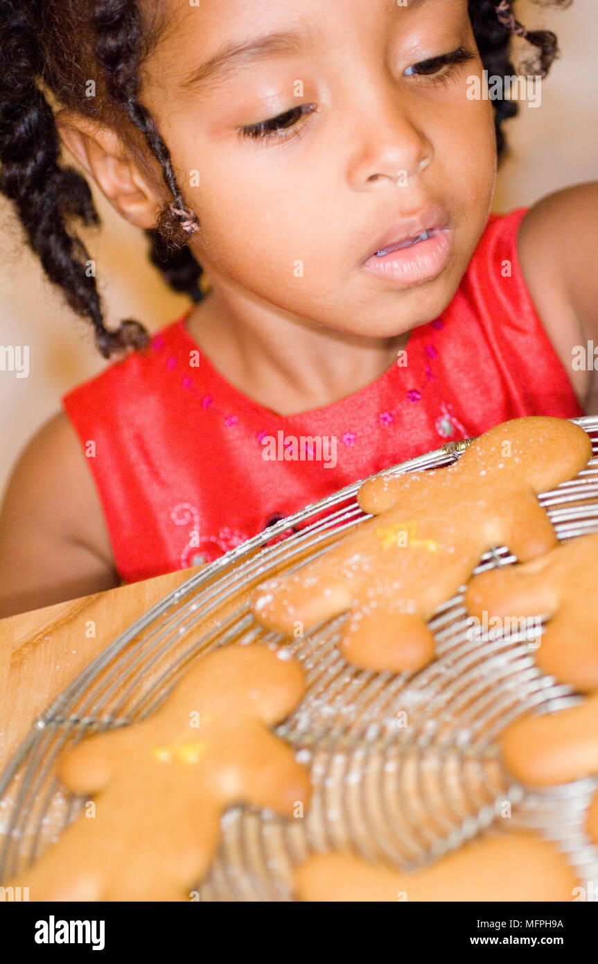 Close-up of a girl looking at cookies Ref: CRUSC 10032 075 Compulsory ...