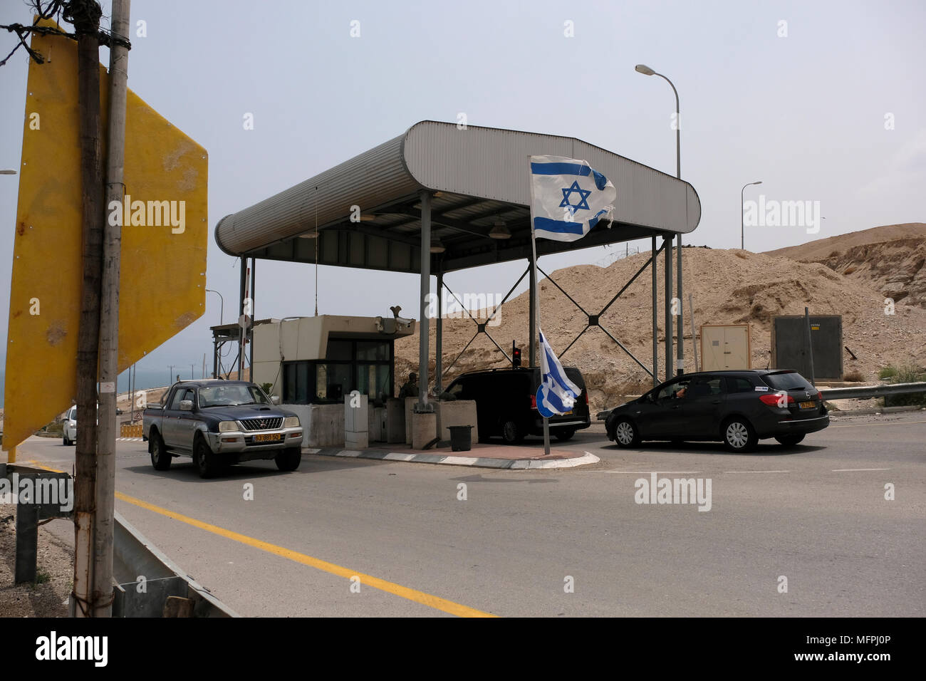 Israeli cars driving through Israeli military checkpoint on highway 90 ...