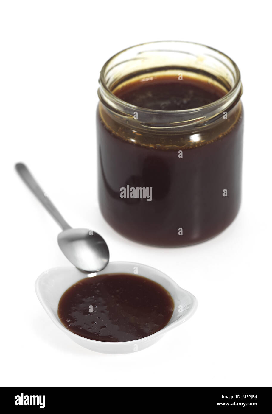 Treacle against White Background Stock Photo - Alamy