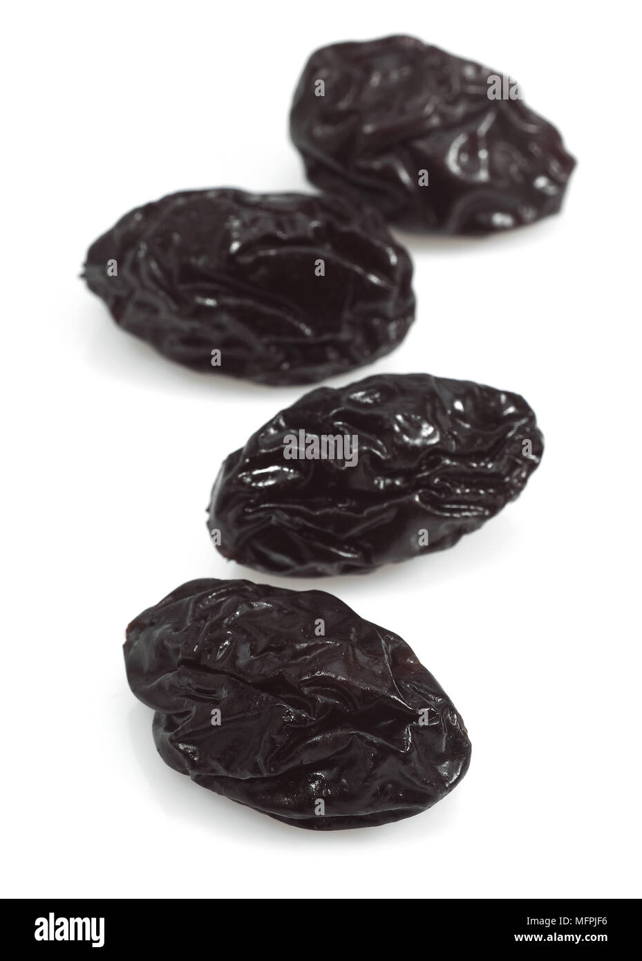 Dry Prunes against White Background Stock Photo - Alamy
