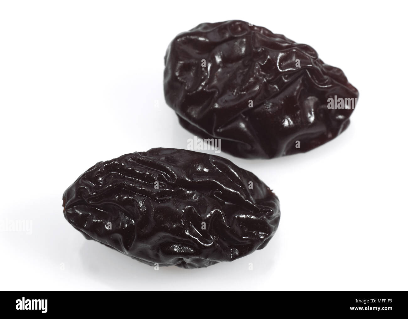 Dry Prunes against White Background Stock Photo - Alamy