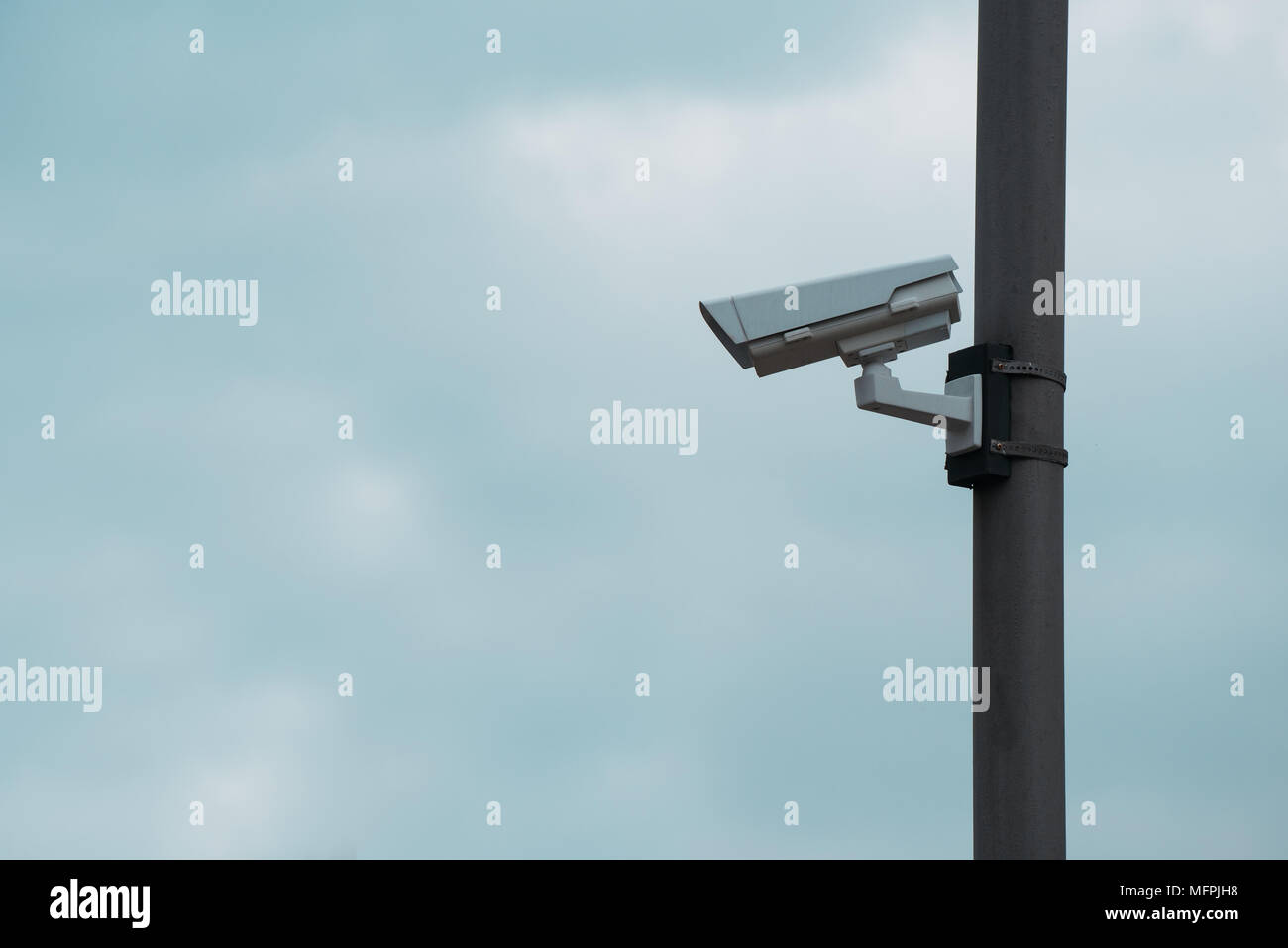 Traffic control surveillance camera mounted on the post Stock Photo - Alamy