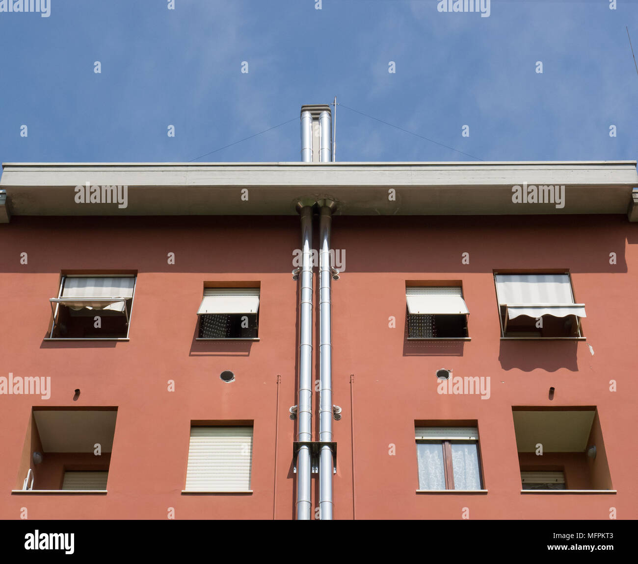 steel chimneys on the facade of a building Stock Photo - Alamy