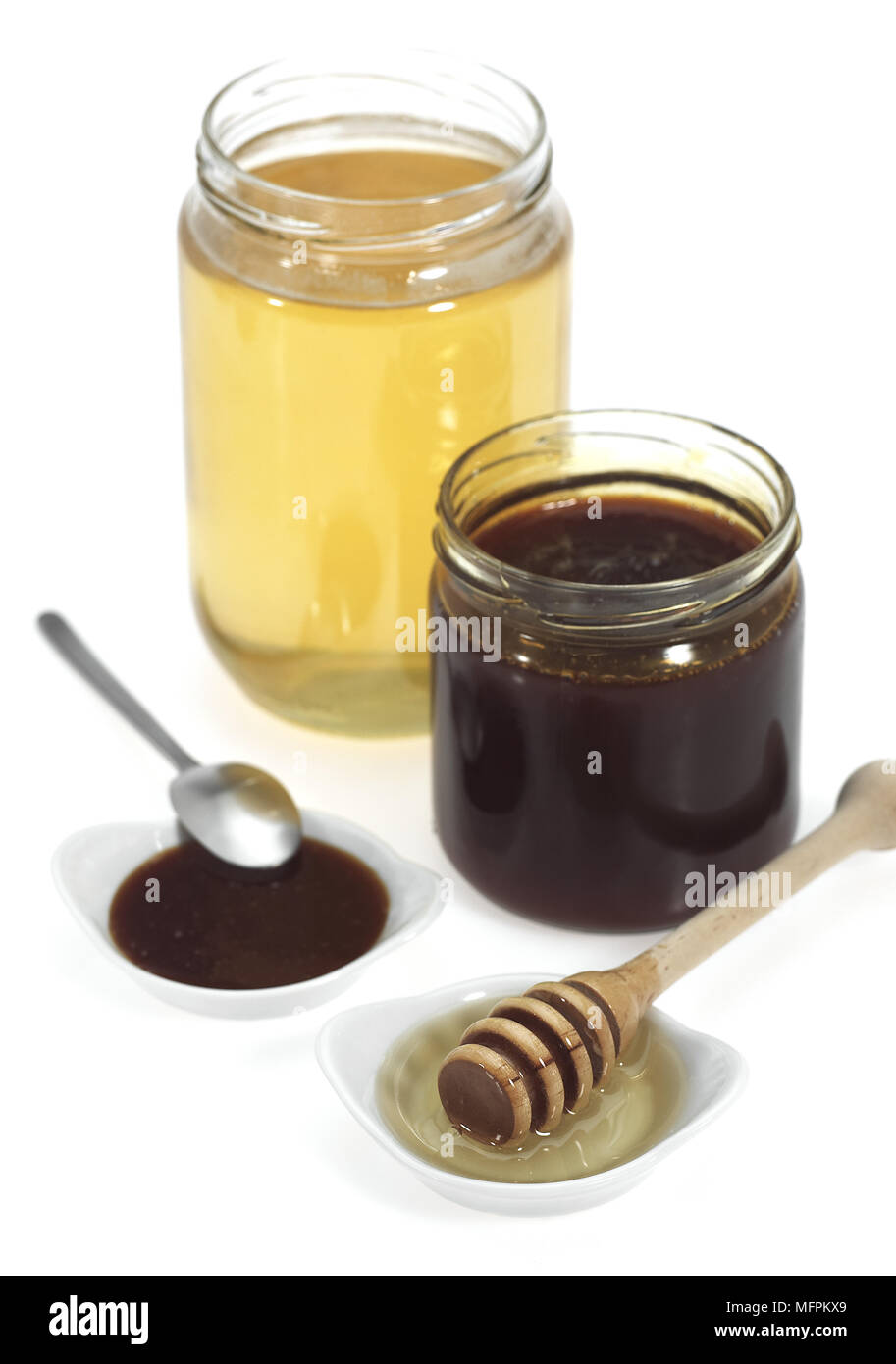 Honey and Treacle Jars against White Background Stock Photo - Alamy