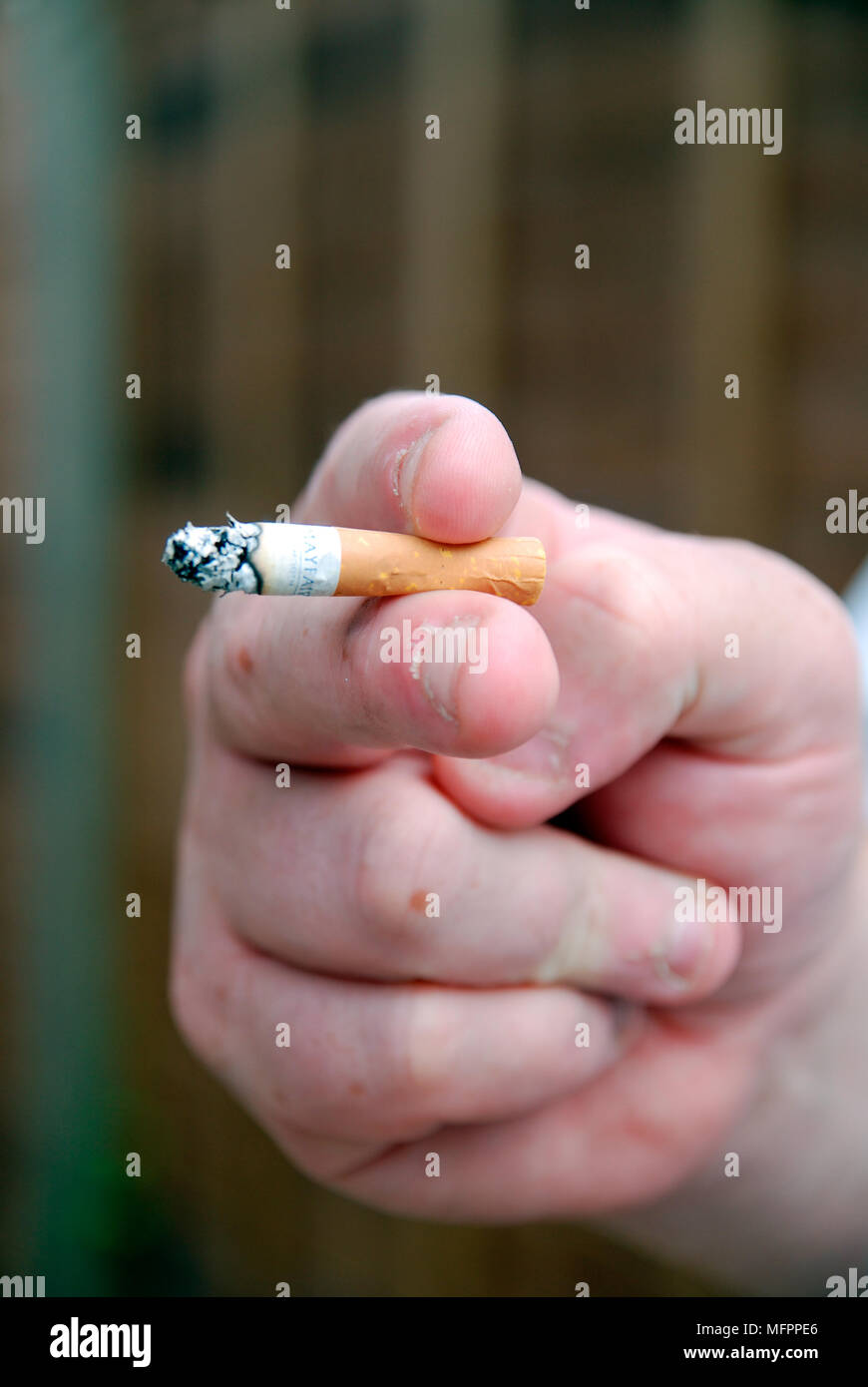 Man smoking a cigarette model release Stock Photo - Alamy
