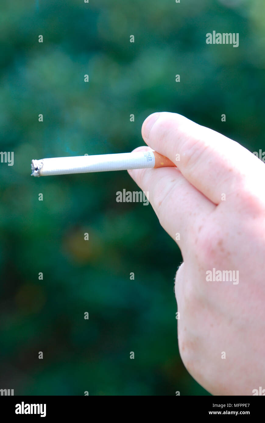 Man smoking a cigarette model release Stock Photo - Alamy
