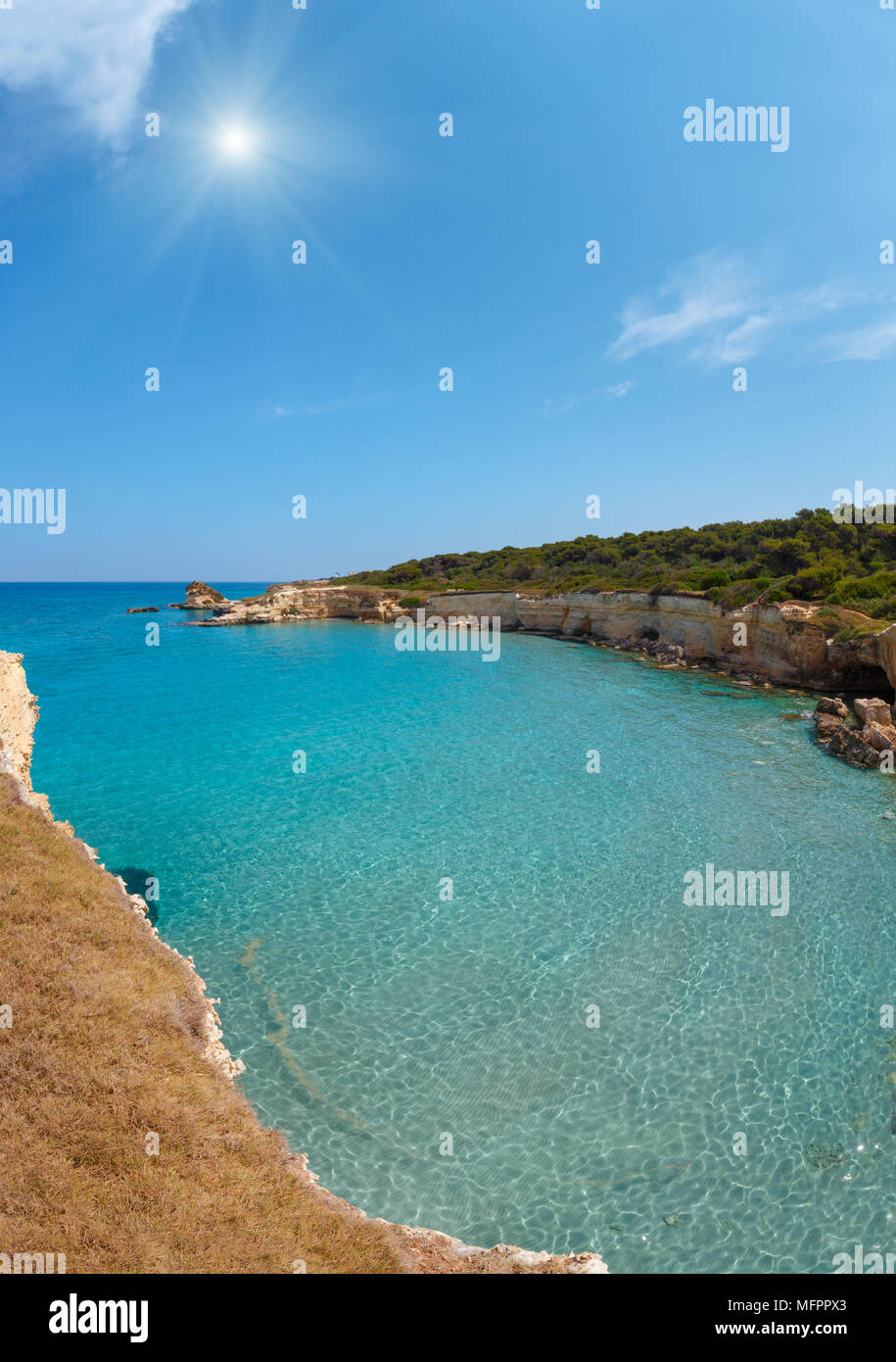 Picturesque sunshiny seascape with white rocky cliffs, sea bay, islets ...