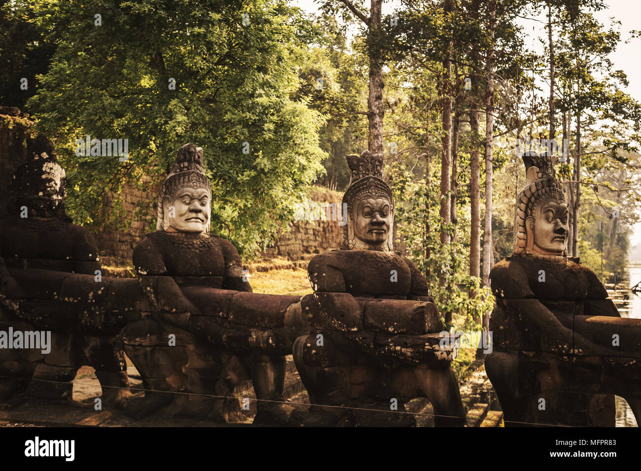 The bridge and the figures of gods and demons. Angkor, Siem Reap ...