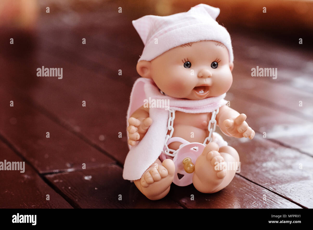 Baby doll, Close-up with background Stock Photo - Alamy