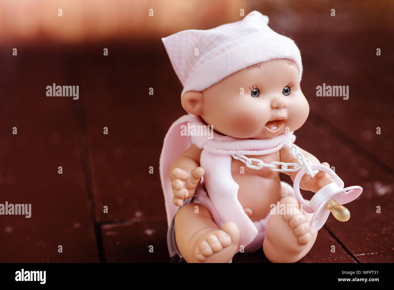 Baby doll, Close-up with background Stock Photo - Alamy