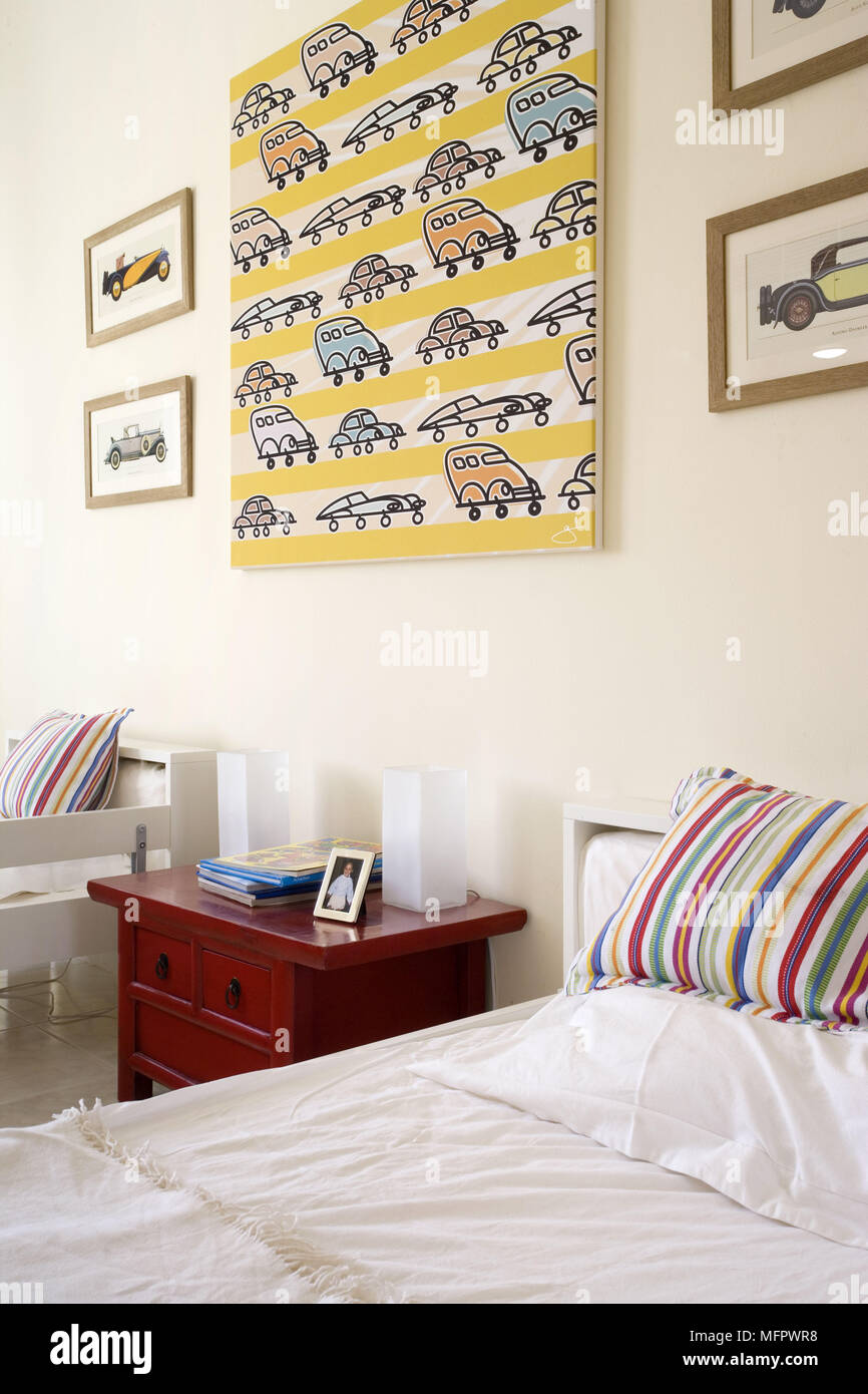 Chest of drawers between pair of single beds in modern bedroom Stock ...