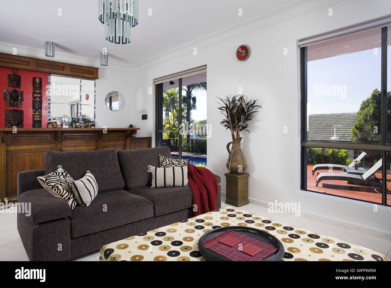 Coffee table in front of upholstered sofa in modern sitting room Stock ...
