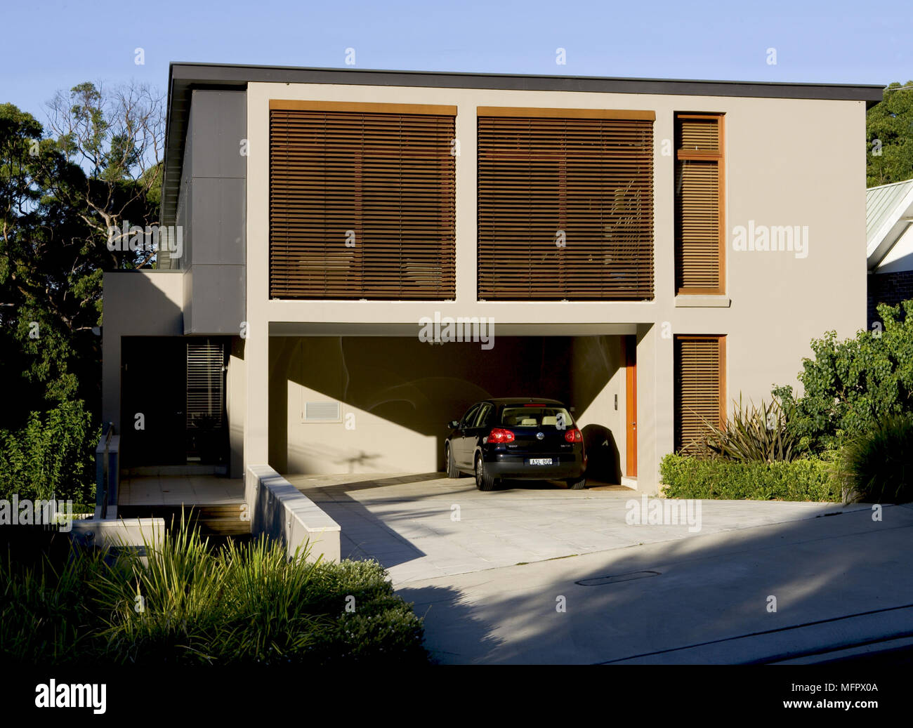Exterior of modern house with integral garage Stock Photo - Alamy
