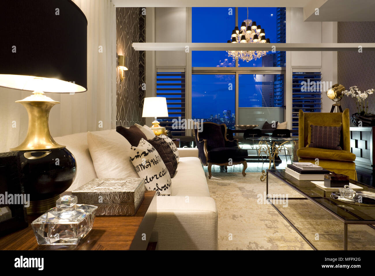 Glass topped coffee table in front of sofa in modern sitting room Stock ...