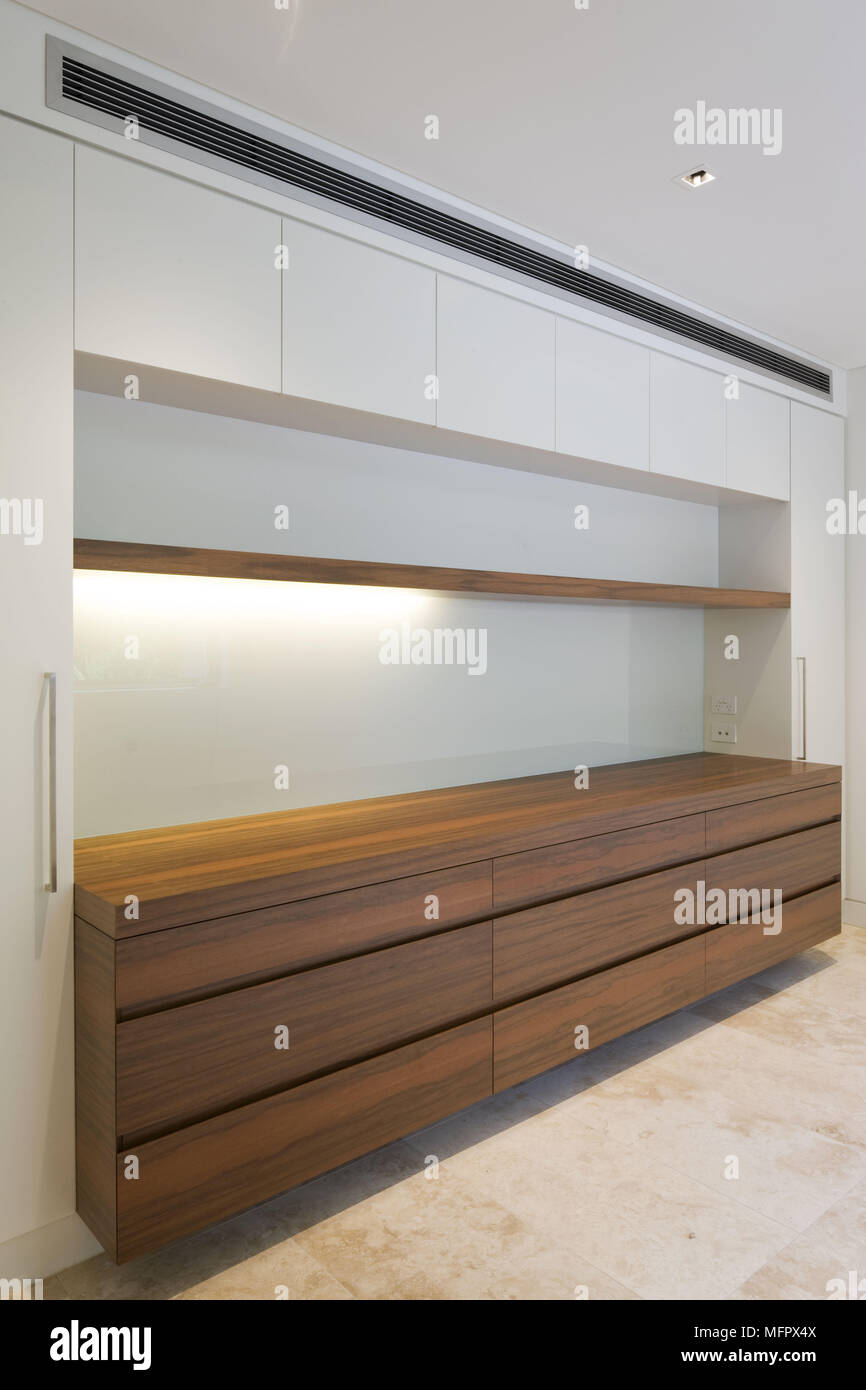 Minimalist side unit with drawers in modern room Stock Photo - Alamy