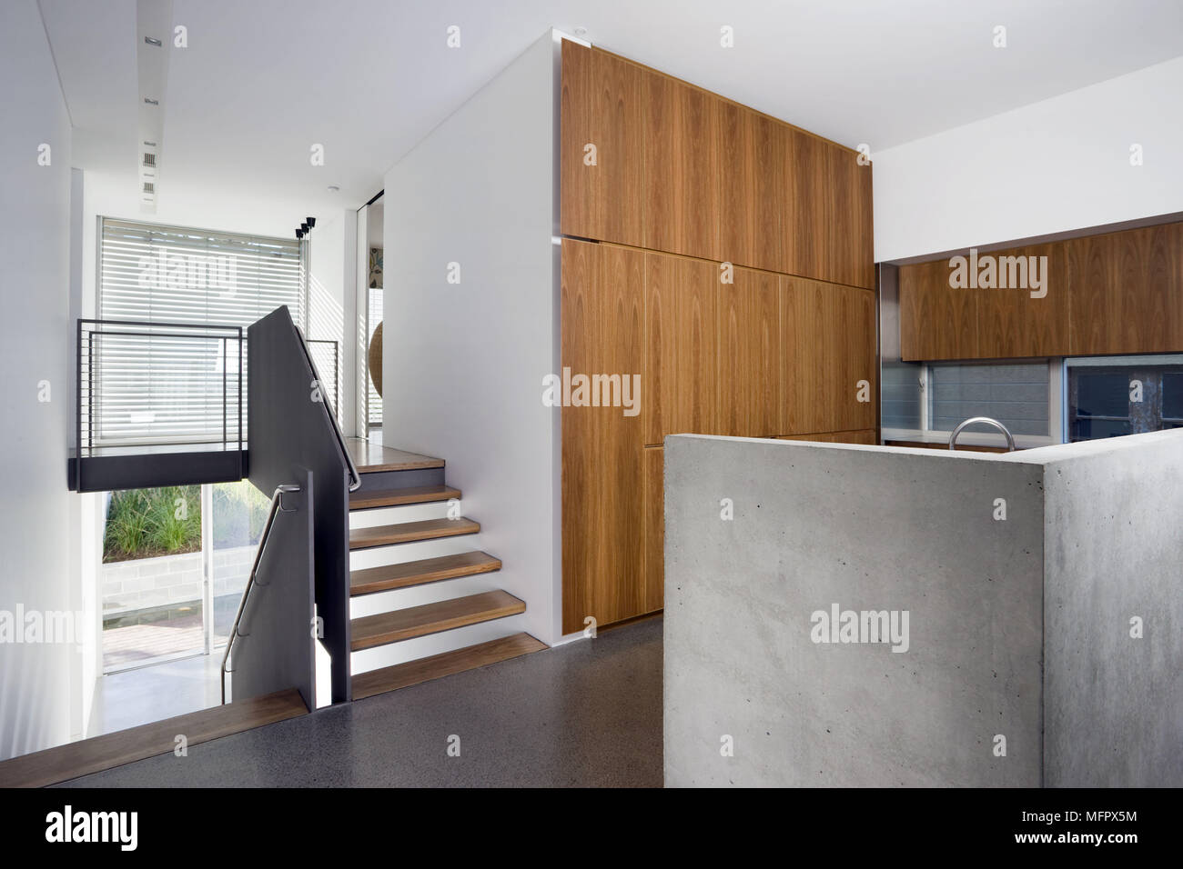 Modern open plan kitchen with concrete central island unit Stock Photo ...