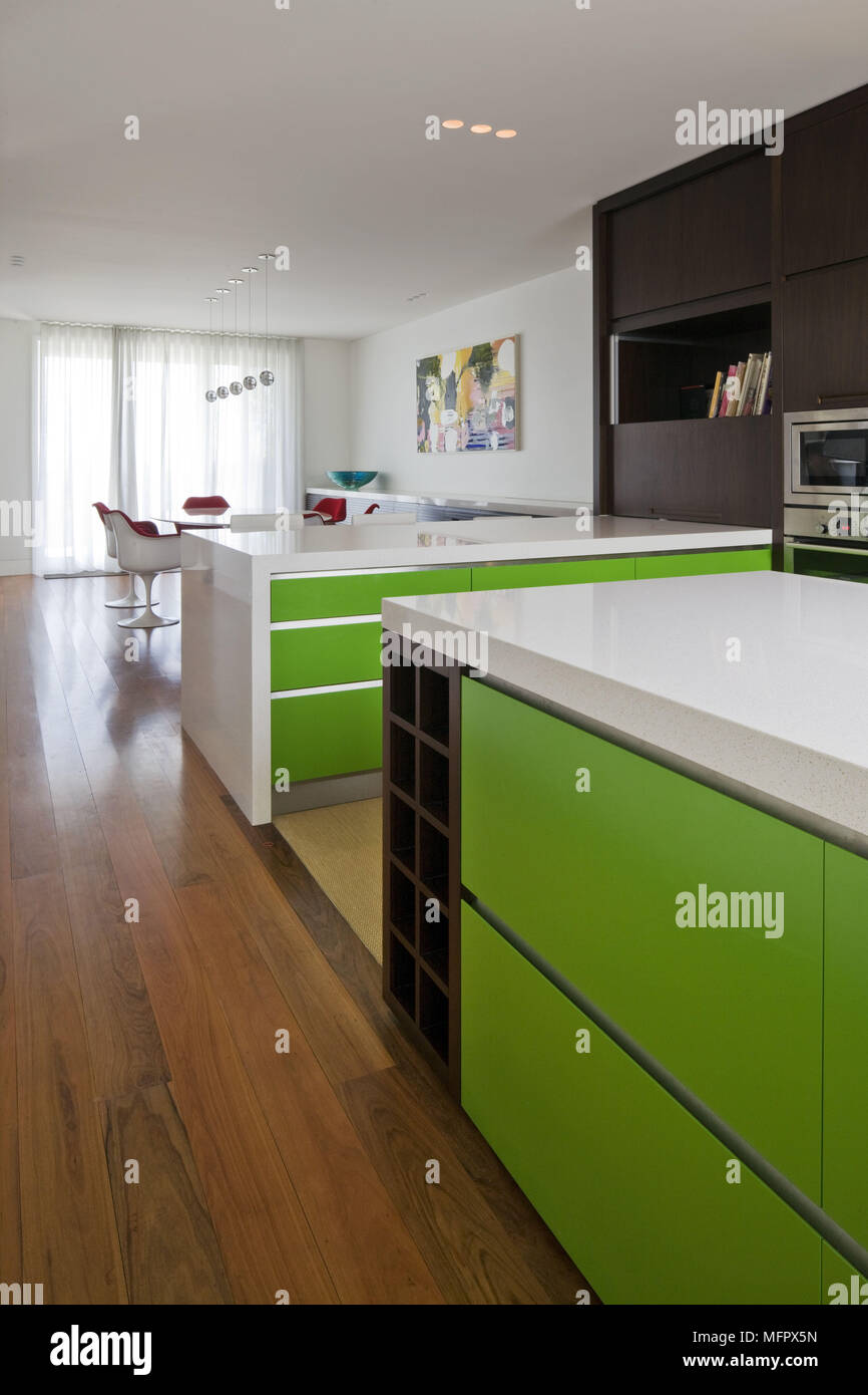 Modern open plan kitchen with green units Stock Photo - Alamy