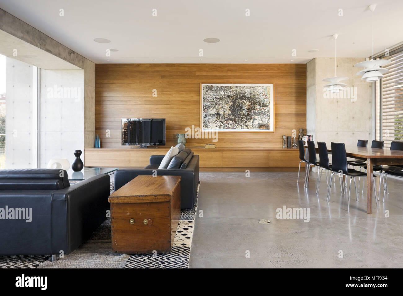 Modern open plan room with sitting and dining areas Stock Photo - Alamy