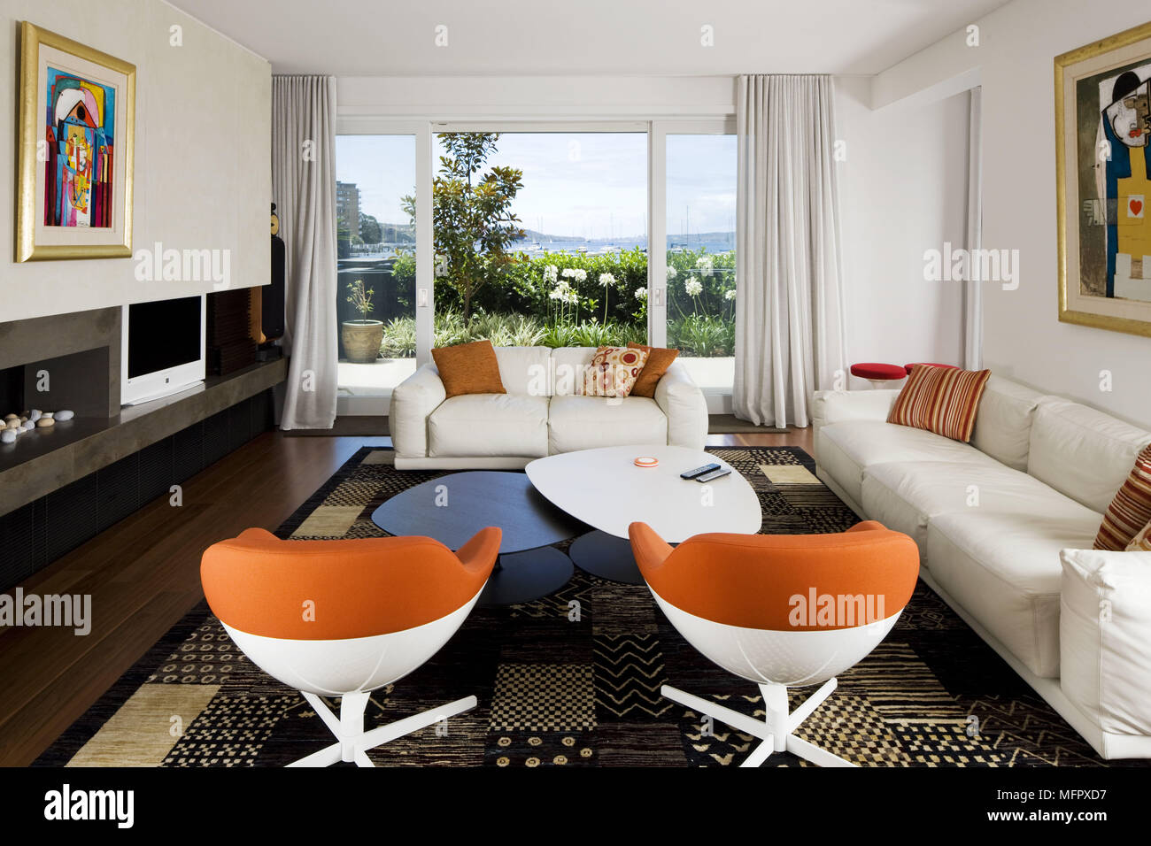 Upholstered seating around coffee table in modern sitting room Stock ...