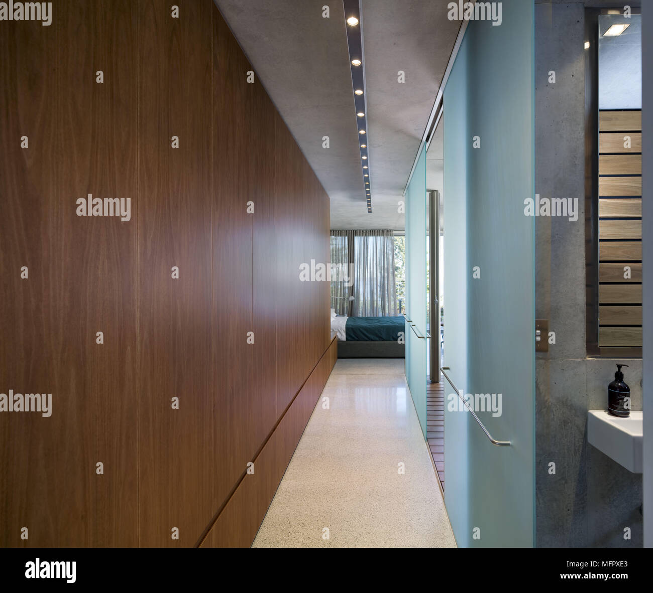 View along hallway with wood panelling on one side Stock Photo - Alamy