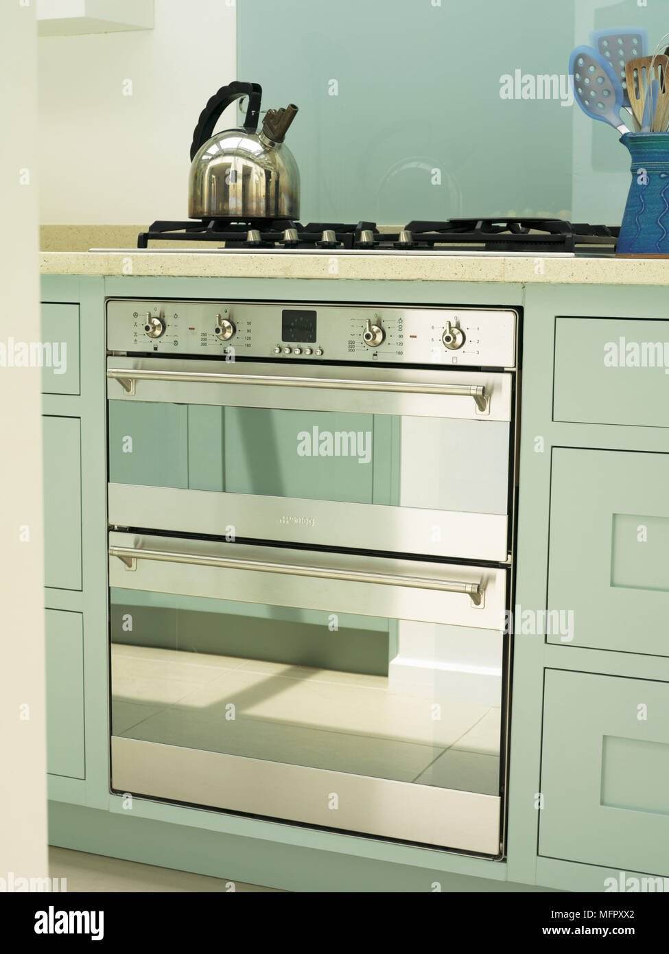 Stainless steel mixer tap over kitchen sink Stock Photo - Alamy