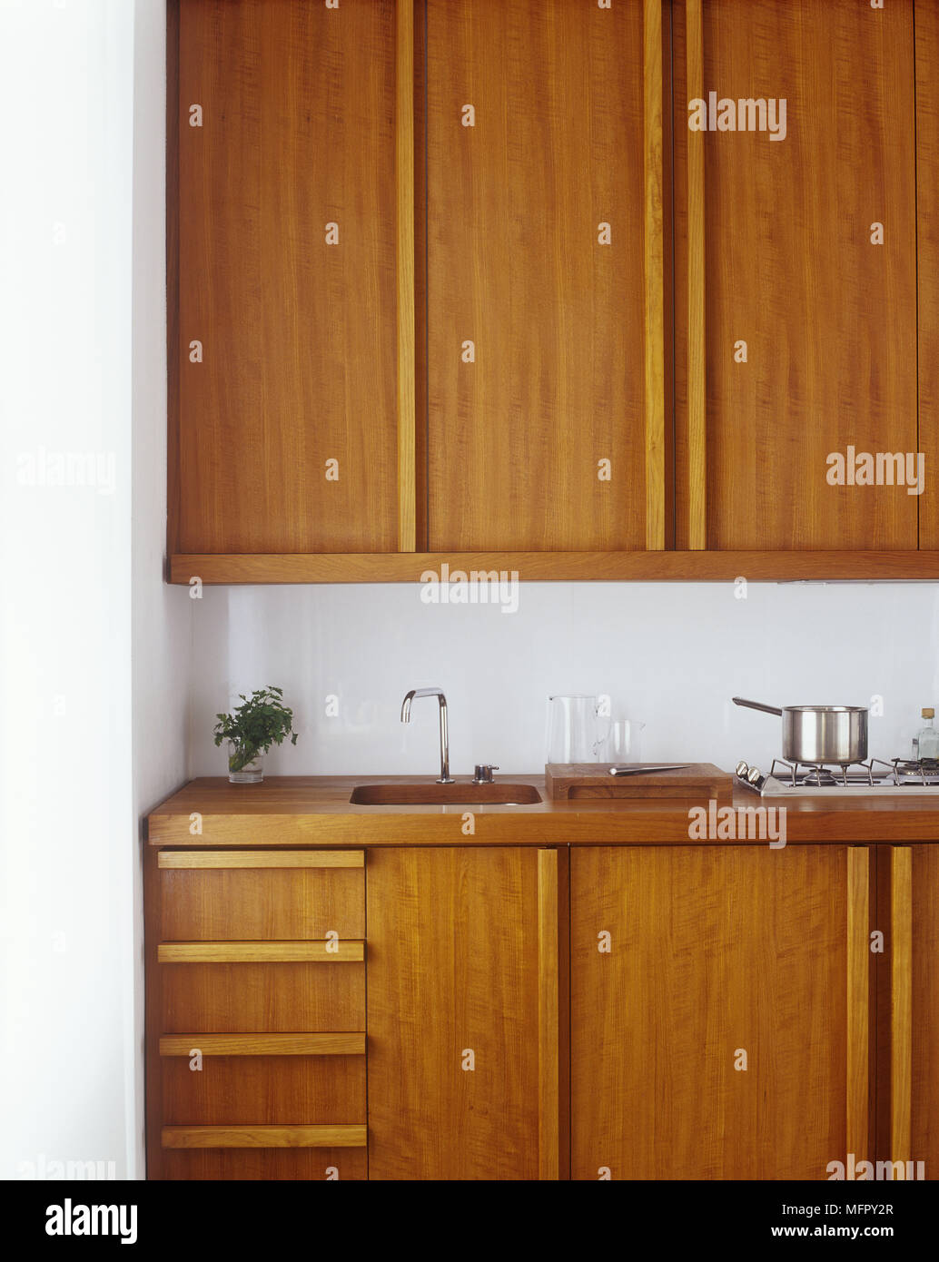Kitchen with wood units and sink Stock Photo - Alamy