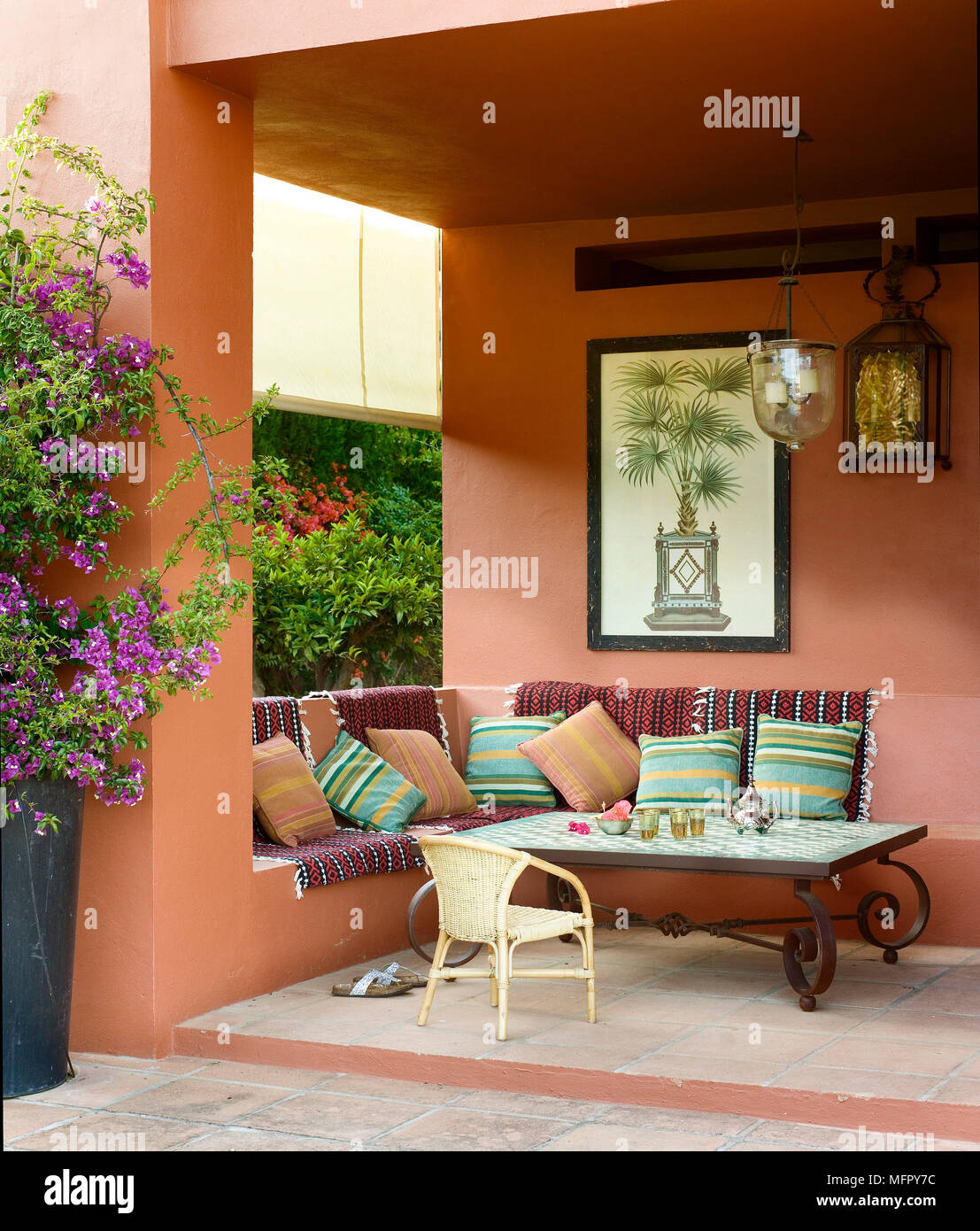 Table and seating on terrace of villa Stock Photo - Alamy