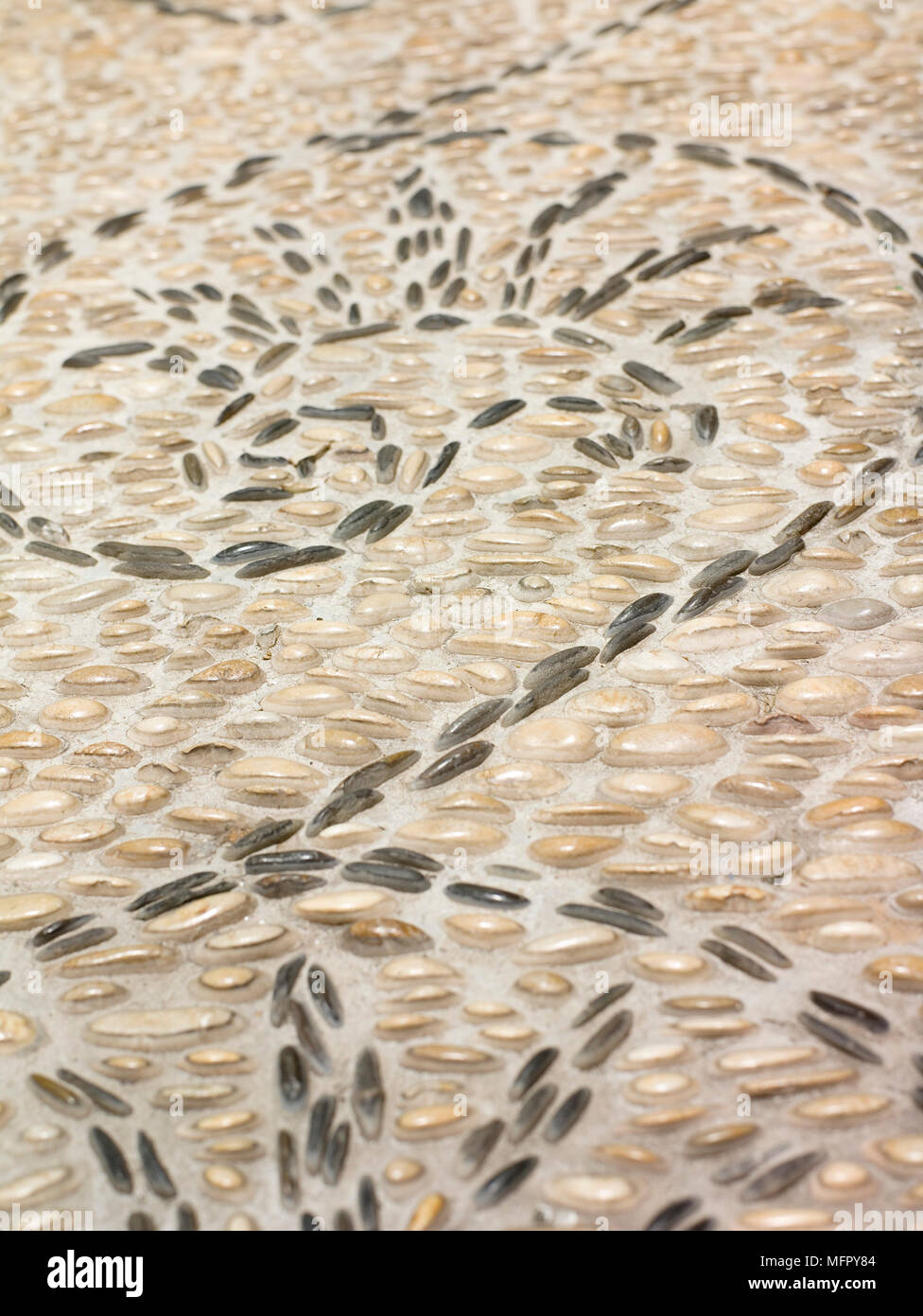 Decorative outdoor paving with pebbles Stock Photo - Alamy