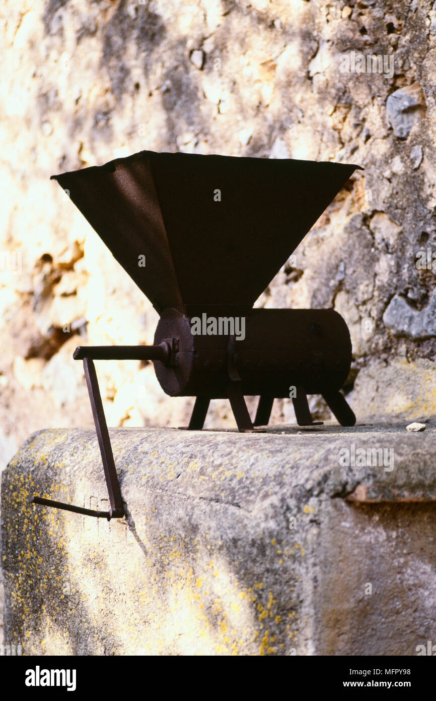Old mincing machine set on rock Stock Photo - Alamy