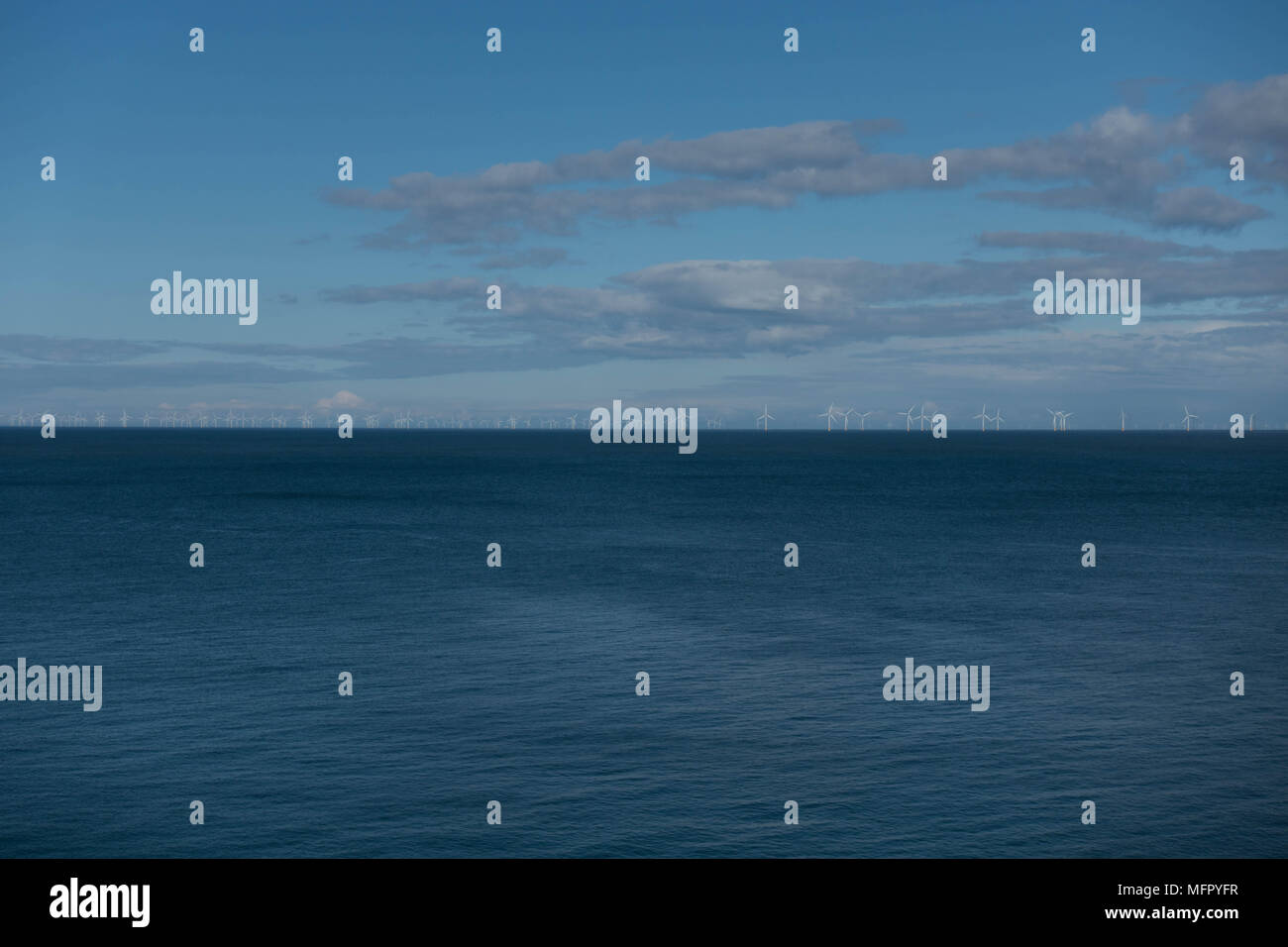 View across sea from the Great Orme with wind turbines in the distance ...