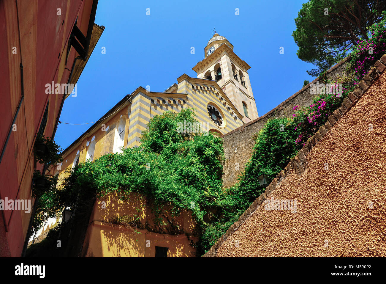 Looking up to the 12th century yellow & grey striped Church of St ...