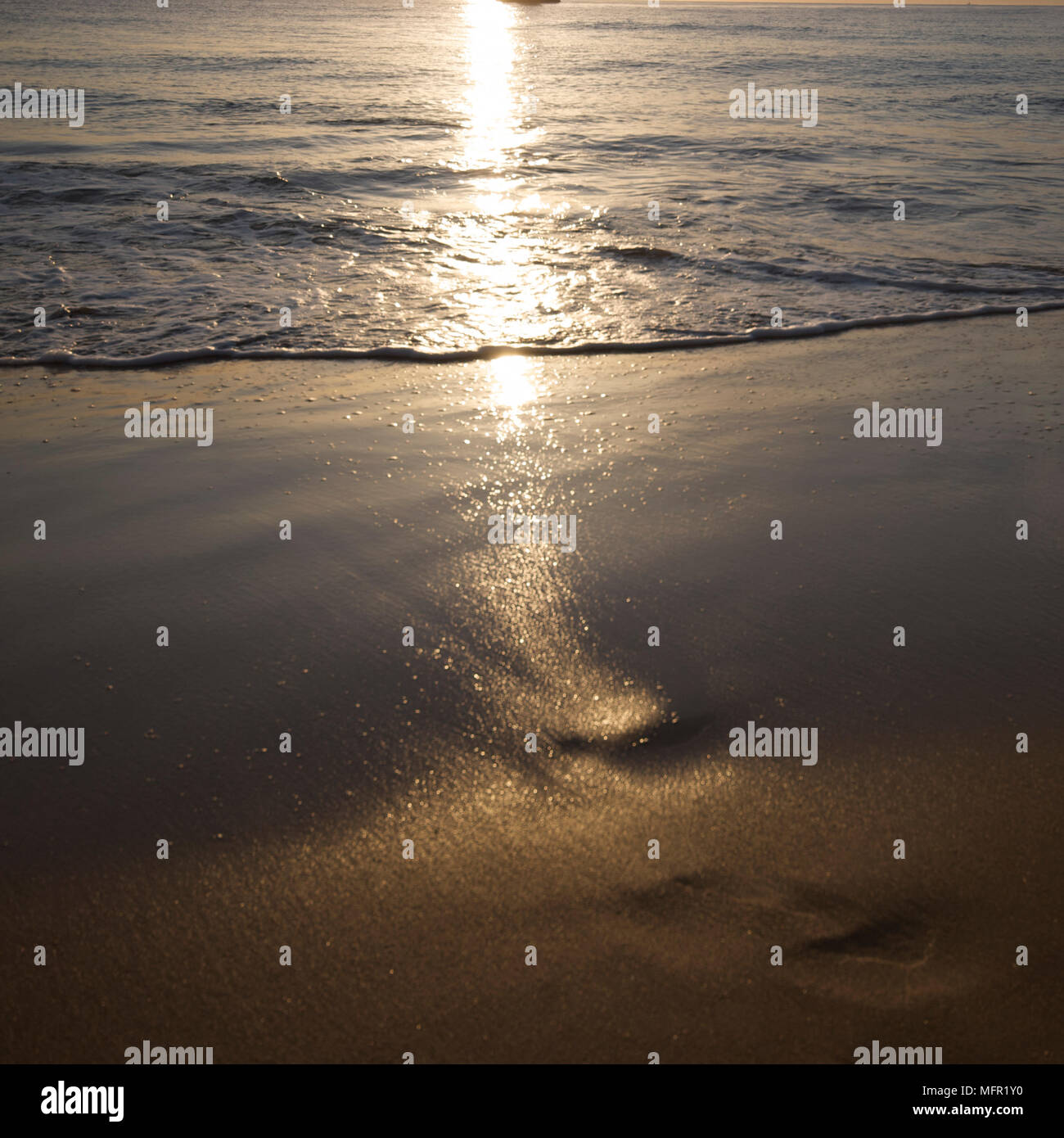 Sea, sun and sand at sunrise Stock Photo - Alamy