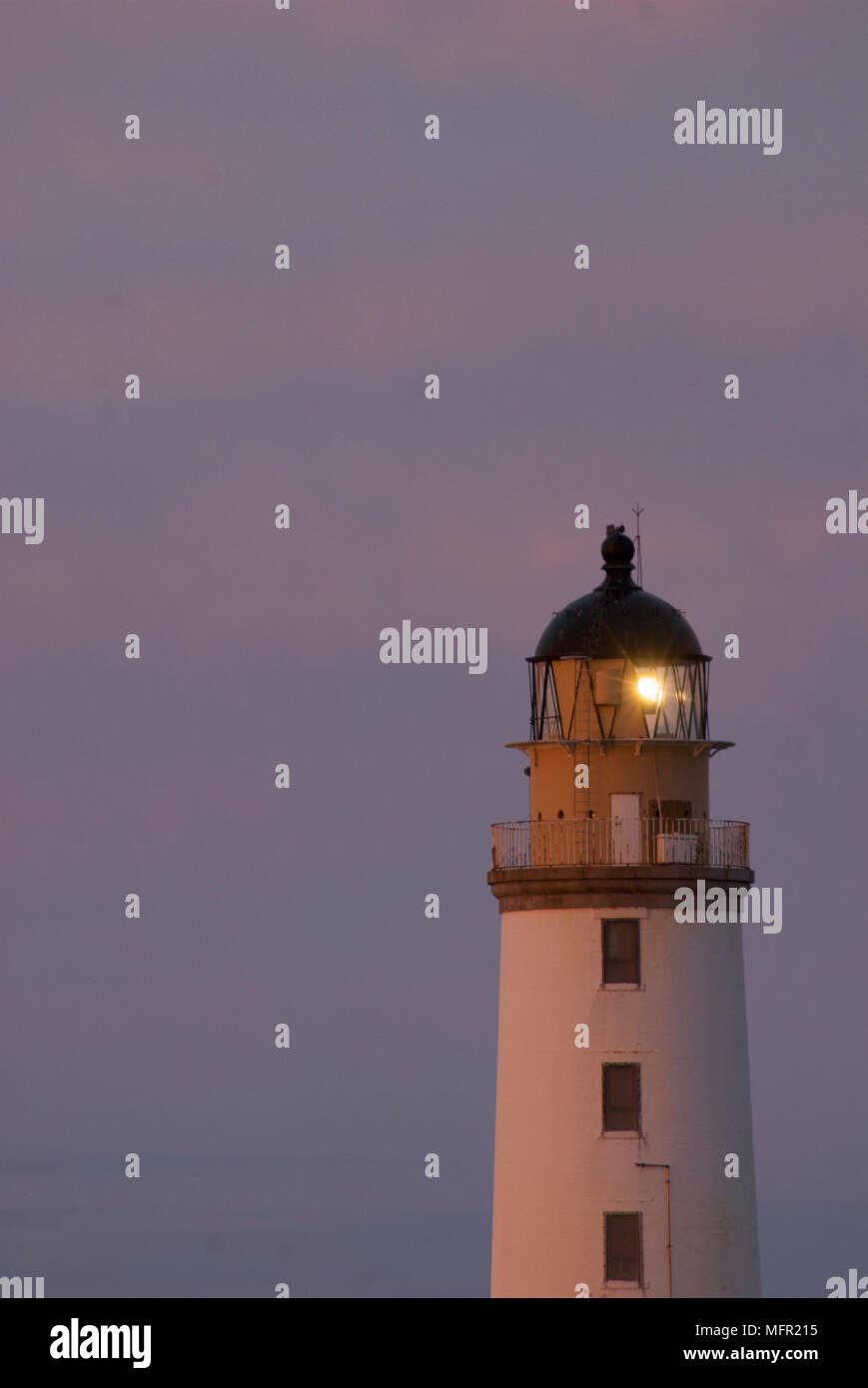 Lighthouse at sunset Stock Photo - Alamy