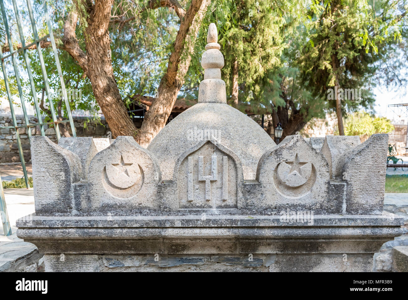 Turk word is engraved with old Turkish alphabet on wall with two ...
