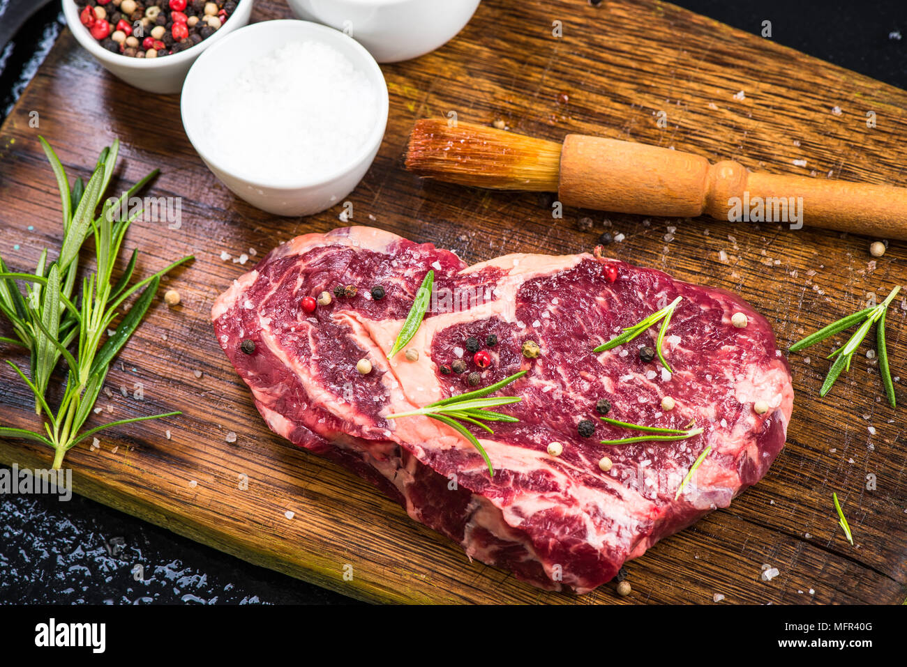 Preparing beef steak for barbecue Stock Photo - Alamy
