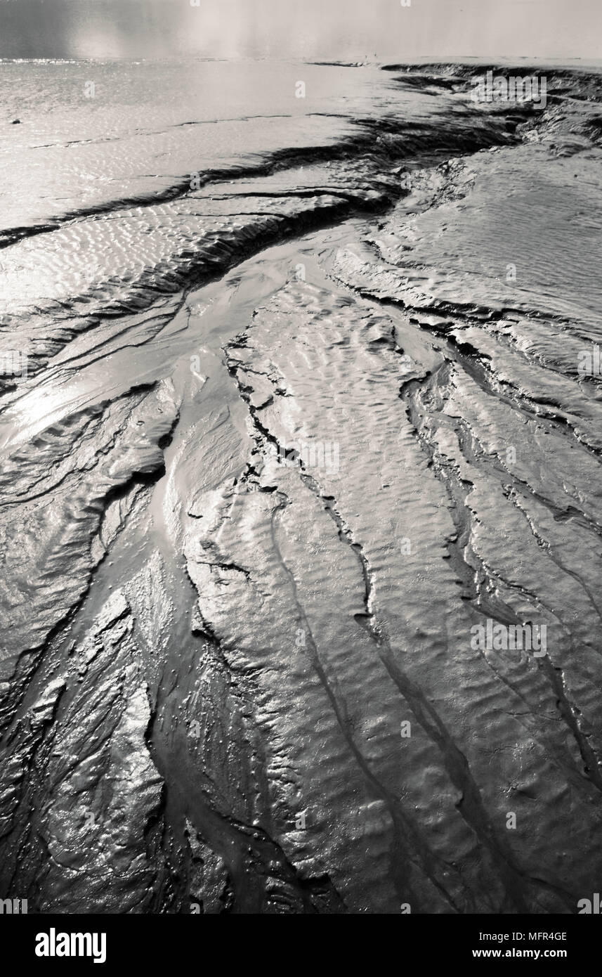 Mud shapes created by the receding tide Stock Photo - Alamy