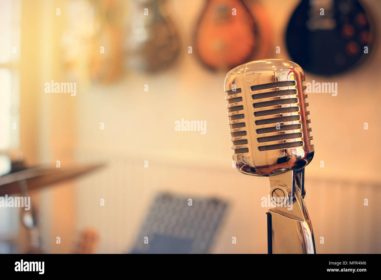 Vintage silver microphone image with warm filter Stock Photo - Alamy