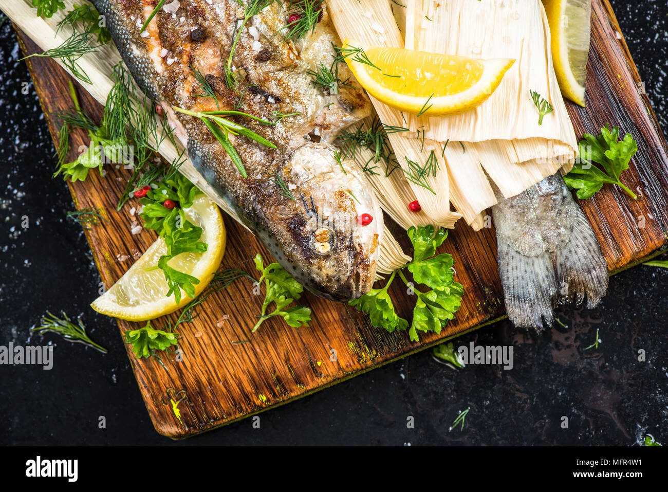 Healthy and diet grilled fish in herbs Stock Photo - Alamy