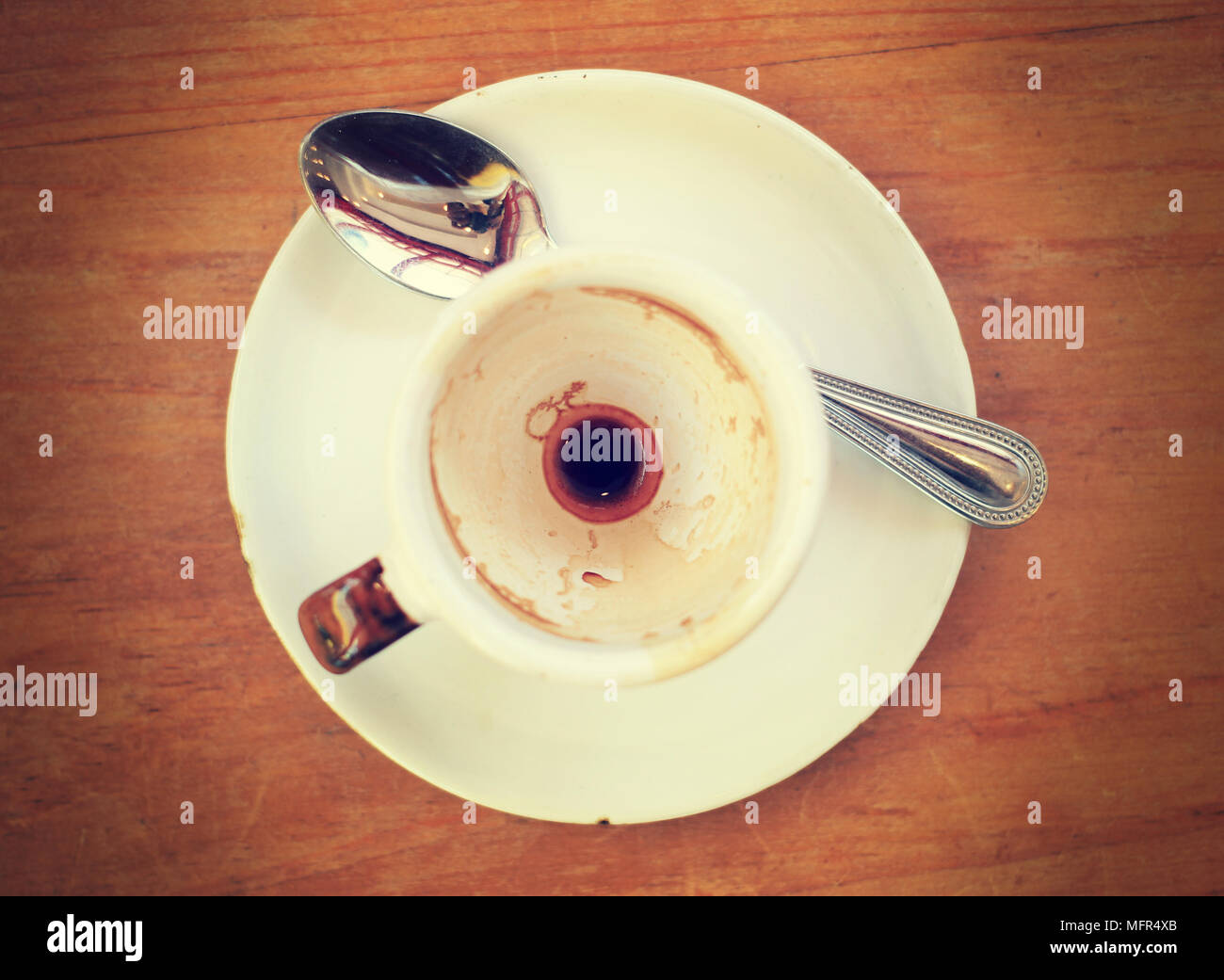 Empty coffee cup on wood table with retro filter Stock Photo - Alamy