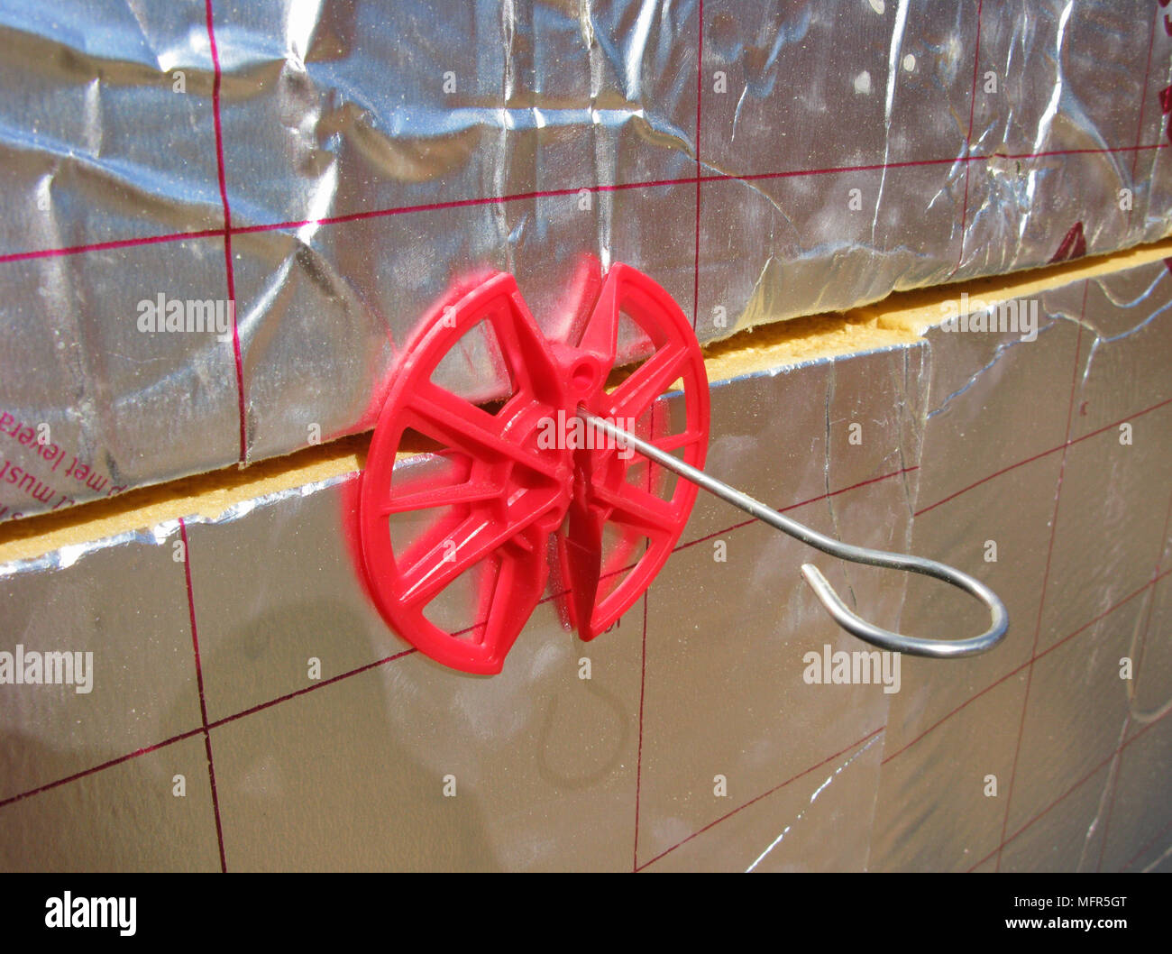 Retaining clips to hold celotex insulation boards in place in ...