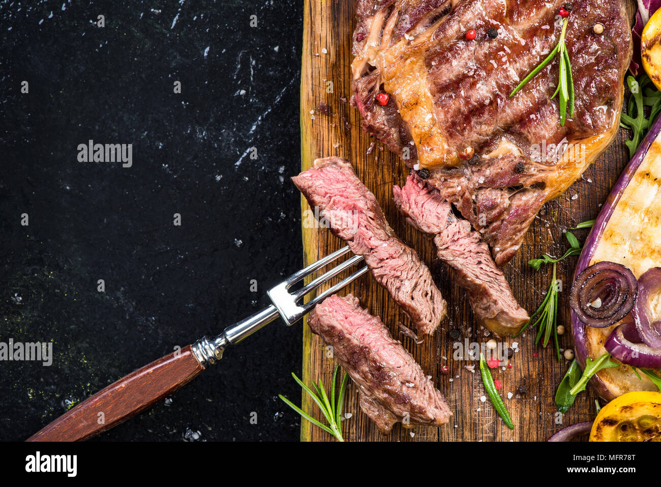 Grilled steak with vegetables, restaurant template Stock Photo - Alamy