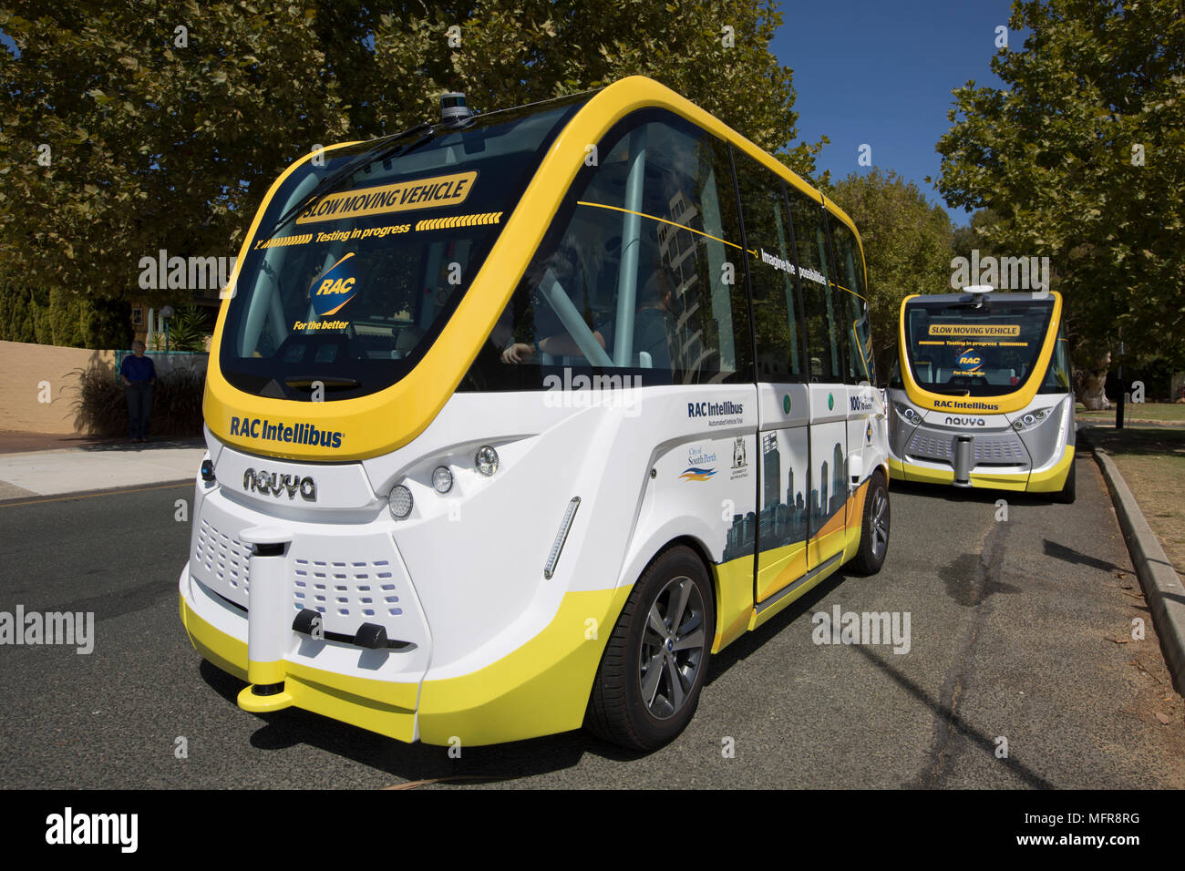Two driverless Intellibus buses undergoing a test drive on the streets ...