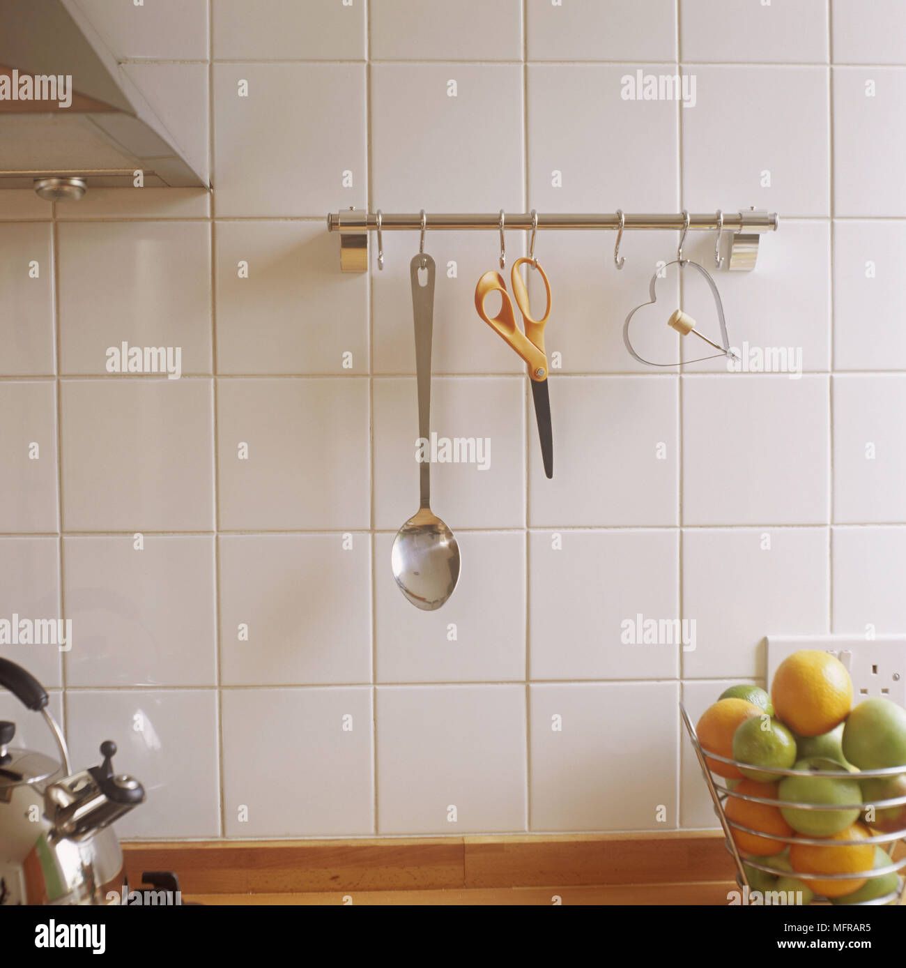 Cooking utensils hanging from hooks hi-res stock photography and images ...