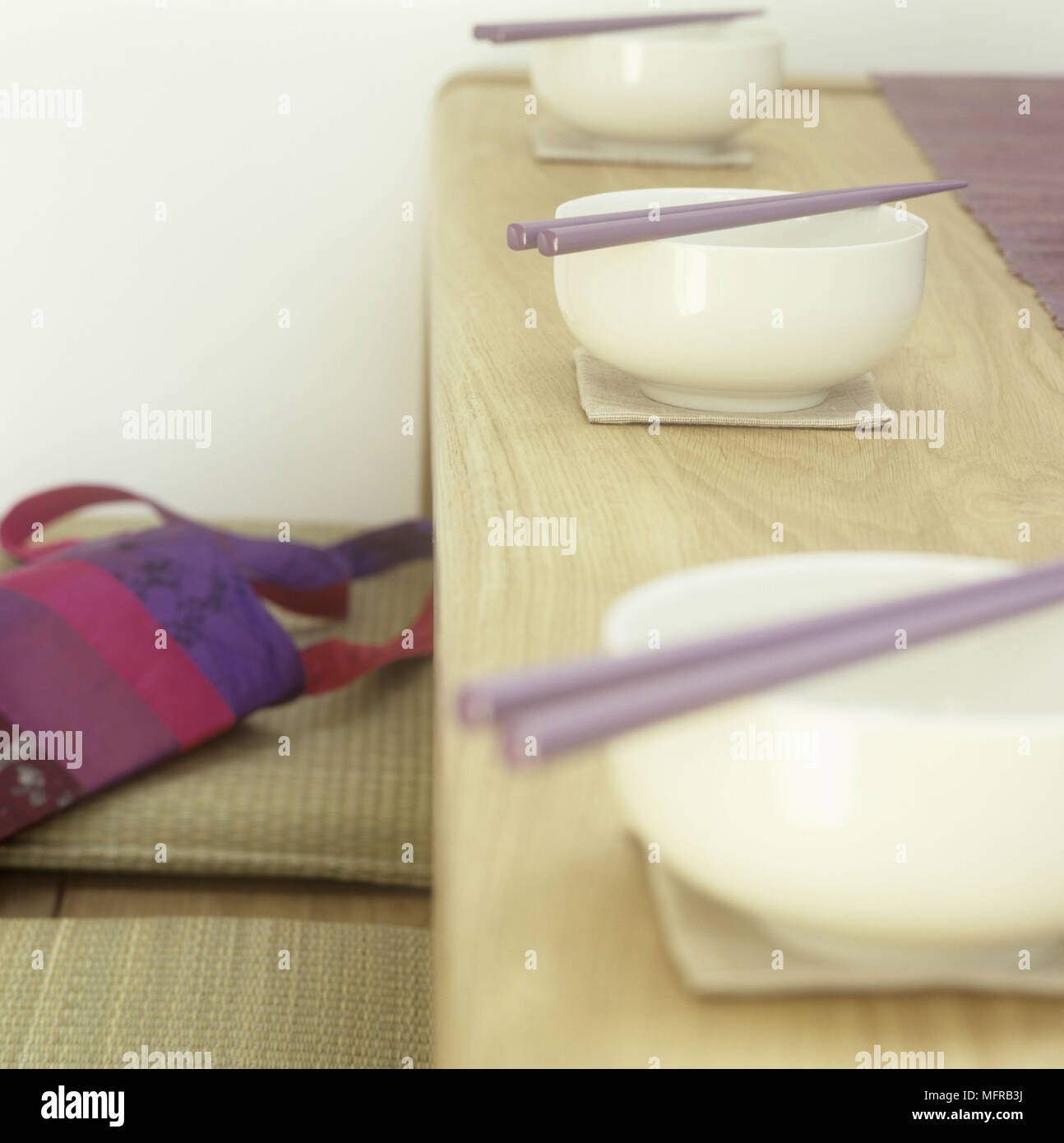 Wooden dining table set with bowls and chop sticks Stock Photo - Alamy
