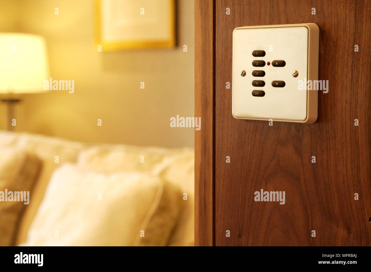 Modern light switch with sofa in the background Stock Photo - Alamy