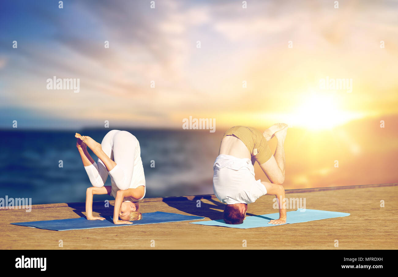 Beautiful couple doing yoga hi-res stock photography and images - Alamy