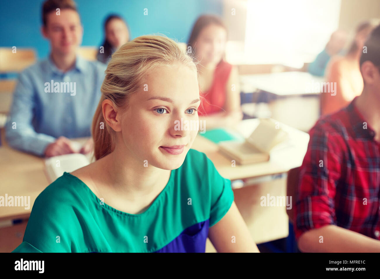 group of students with books at school lesson Stock Photo - Alamy