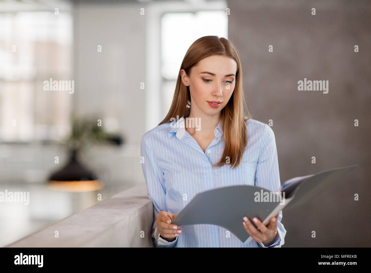 female office worker with folder Stock Photo - Alamy