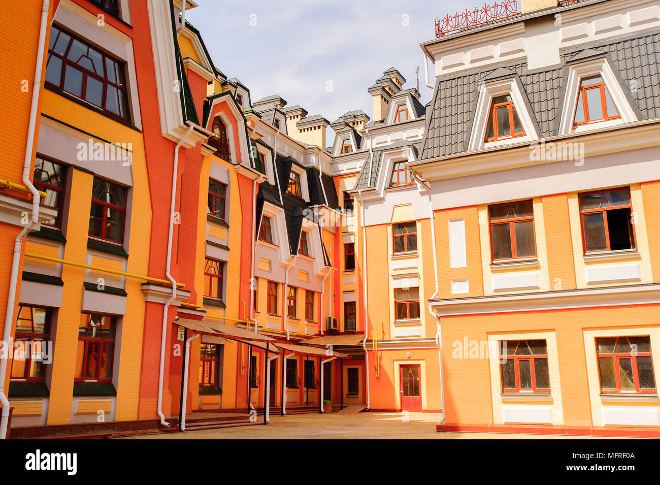 Different colored building Stock Photo - Alamy